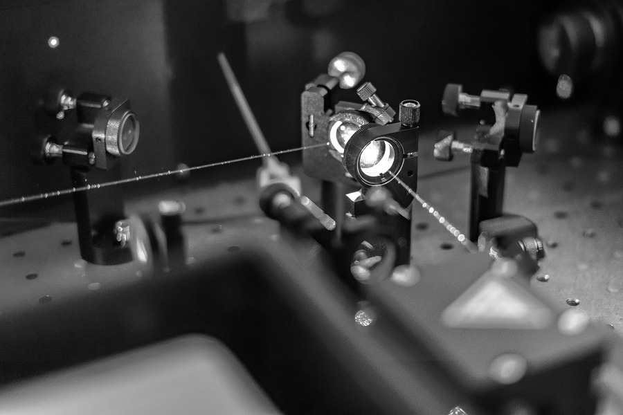 What is a neutral density filter for in laser applications?